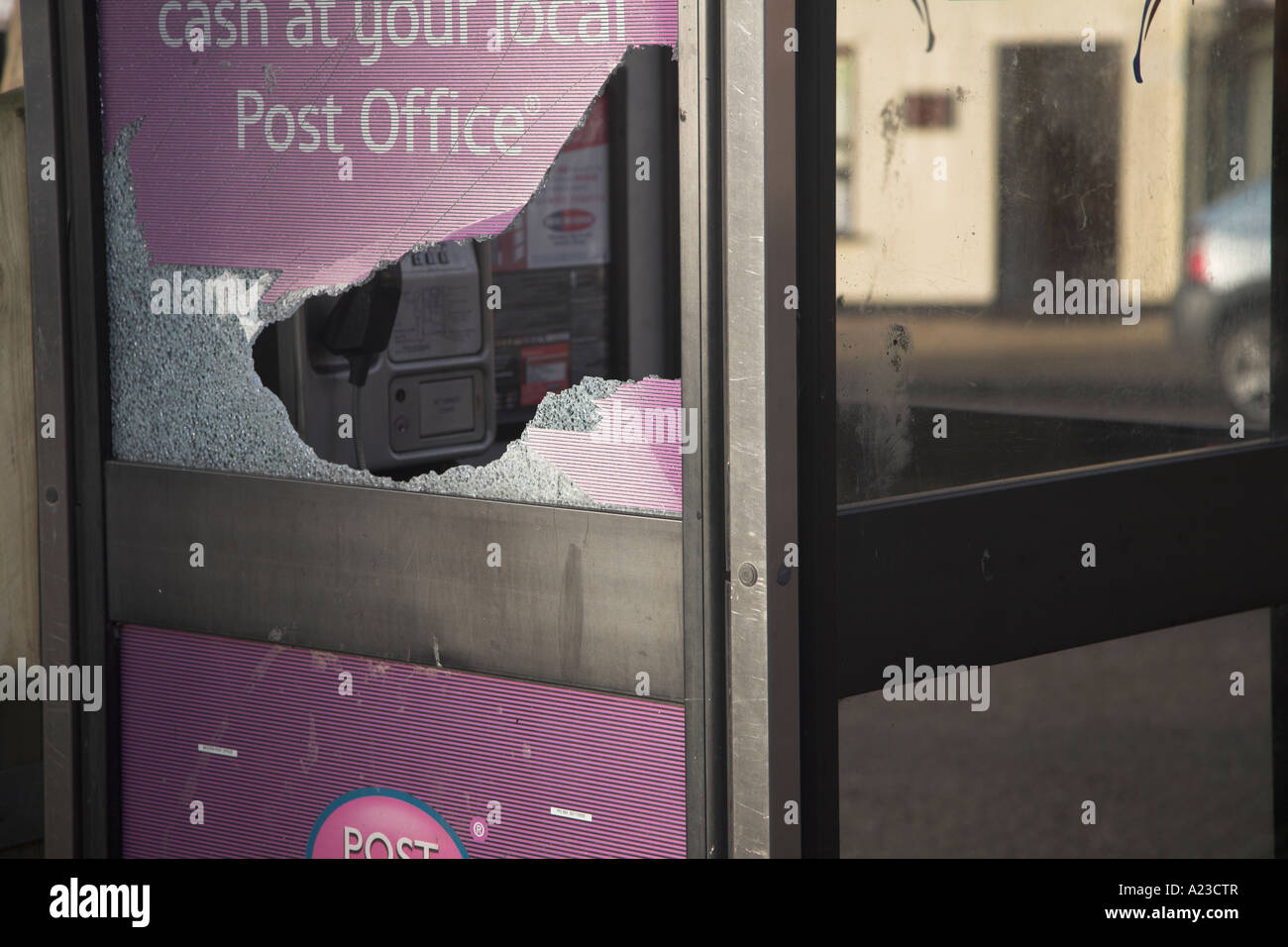 Vandalised phone box with smashed glass panel Stock Photo - Alamy