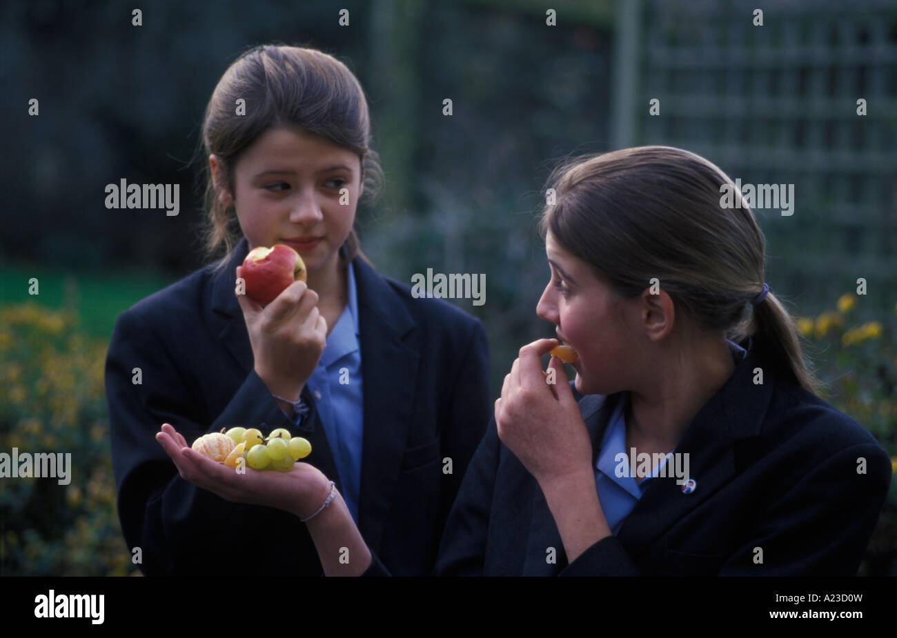 school girls eating healthy snacks Stock Photo - Alamy