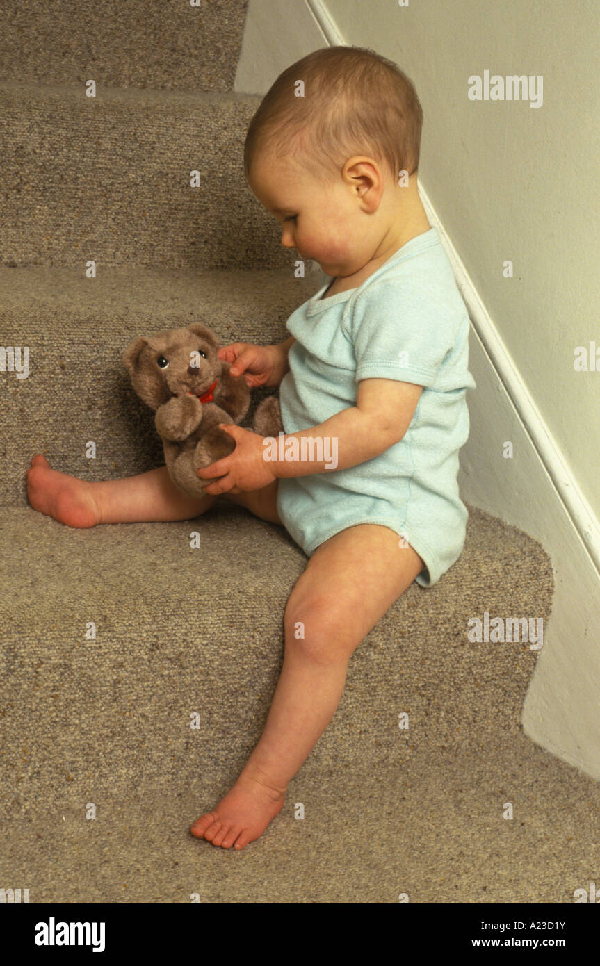 baby sitting on stairs in danger of falling Stock Photo - Alamy