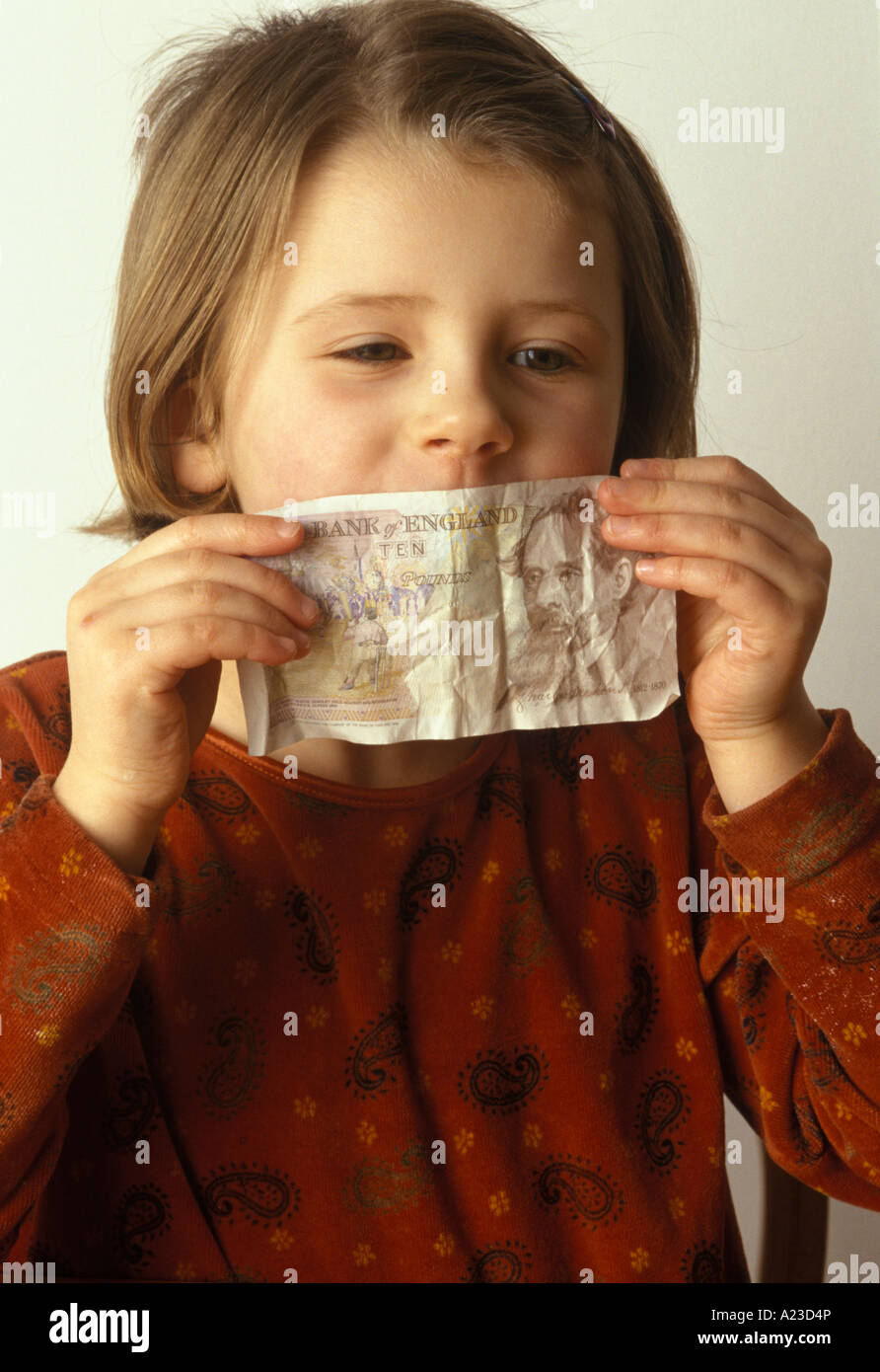girl kissing banknote Stock Photo - Alamy