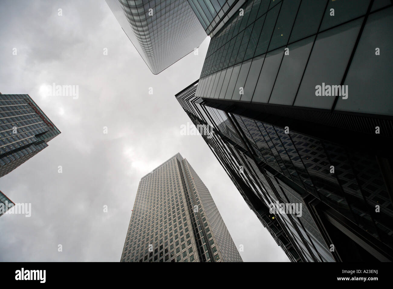 a stormy grey sky looms over highrise modern office buildings in the ...