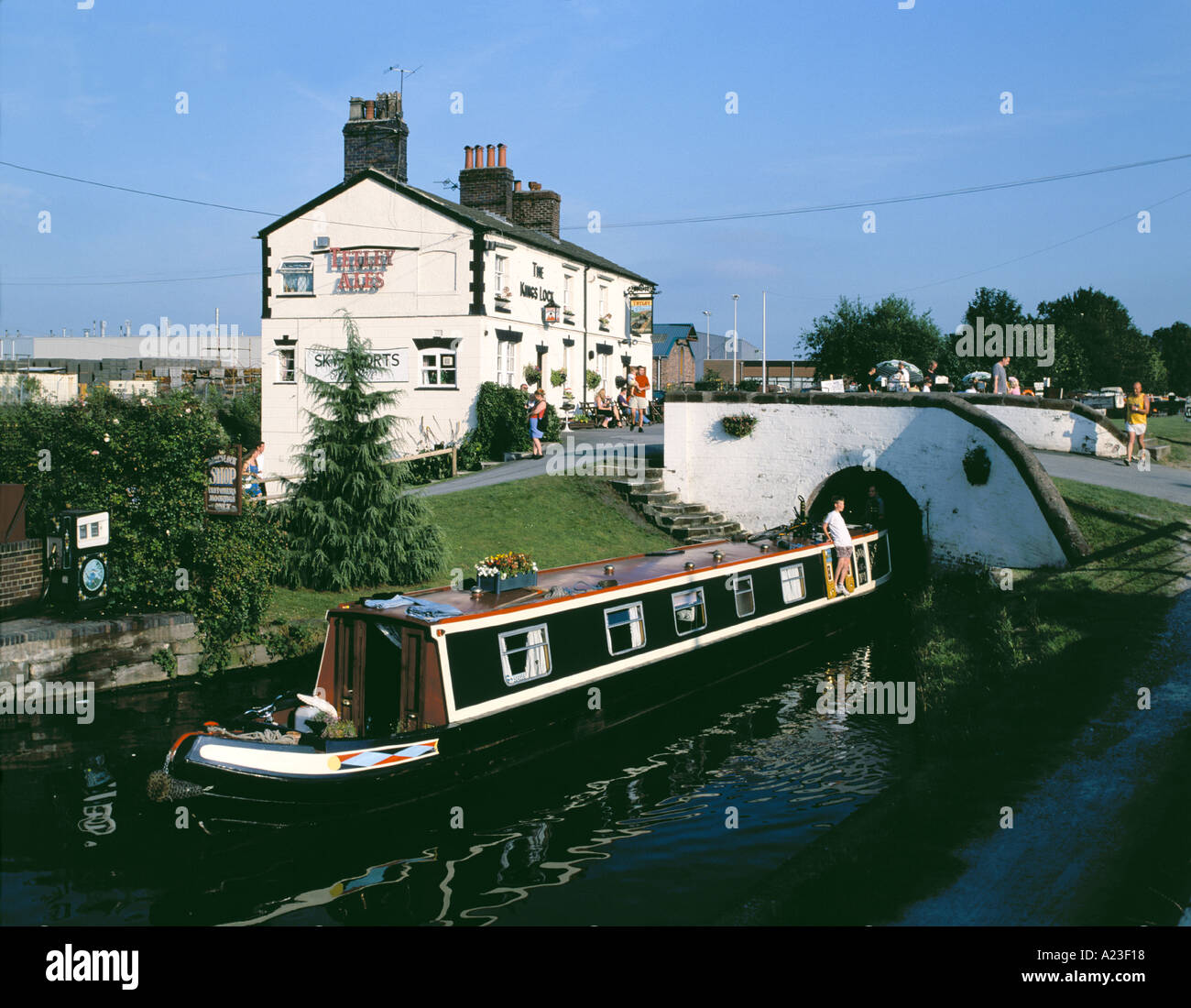Longboat negotiating the famous King's Lock near Middlewich in Cheshire ...
