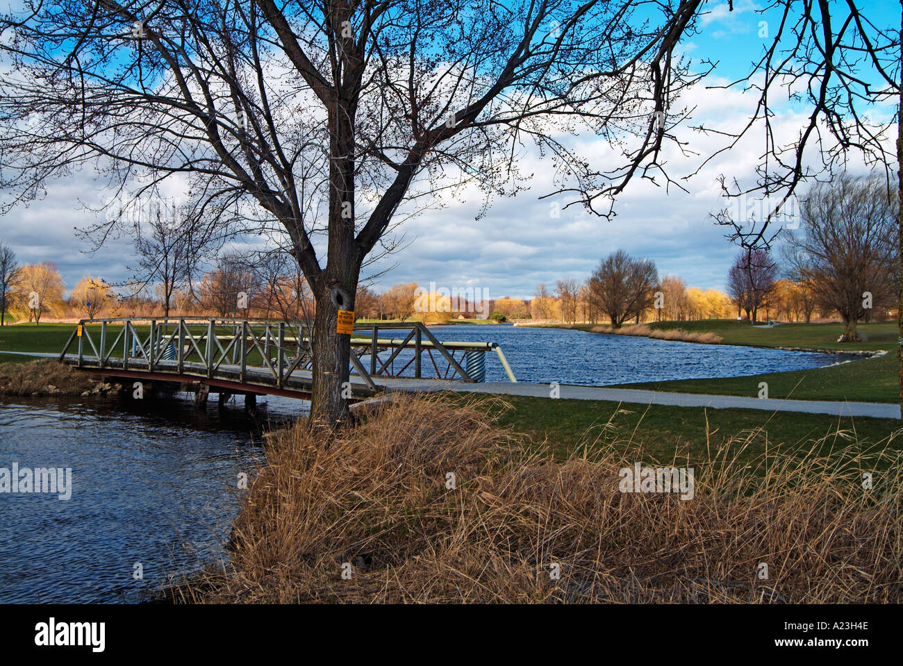 Landscape wooden bridge over river Stock Photo - Alamy