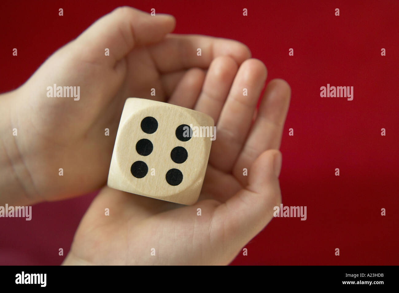 child s hands with dice Stock Photo - Alamy