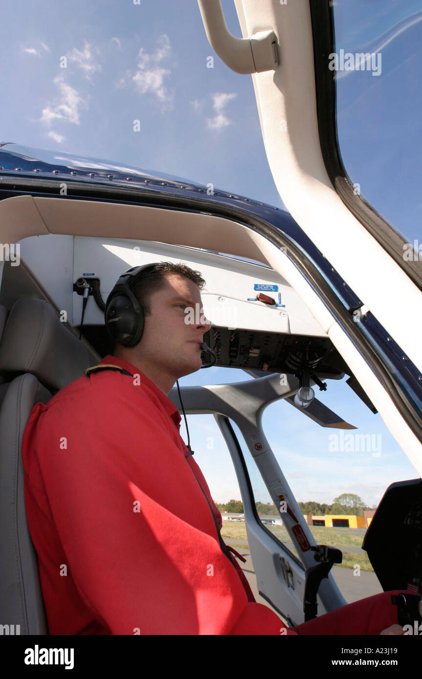 Helicopter with pilot Stock Photo - Alamy