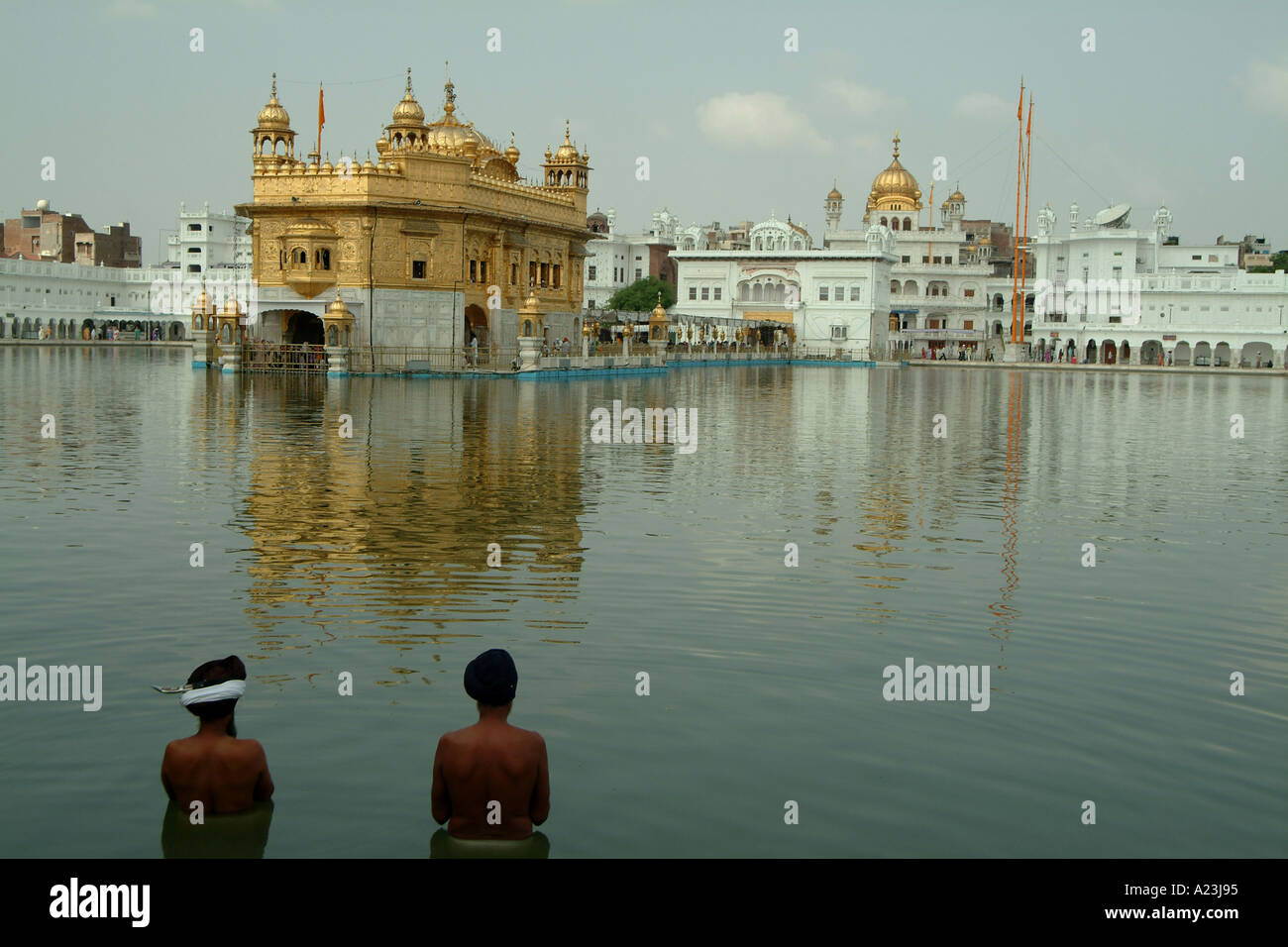 Two men taking holy bath in sacred water called sarower at Golden ...