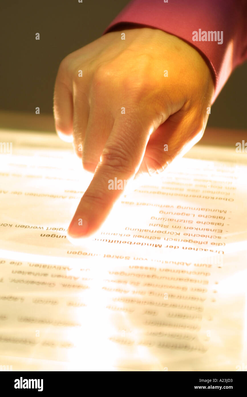 Finger pointing at overhead projector Stock Photo - Alamy