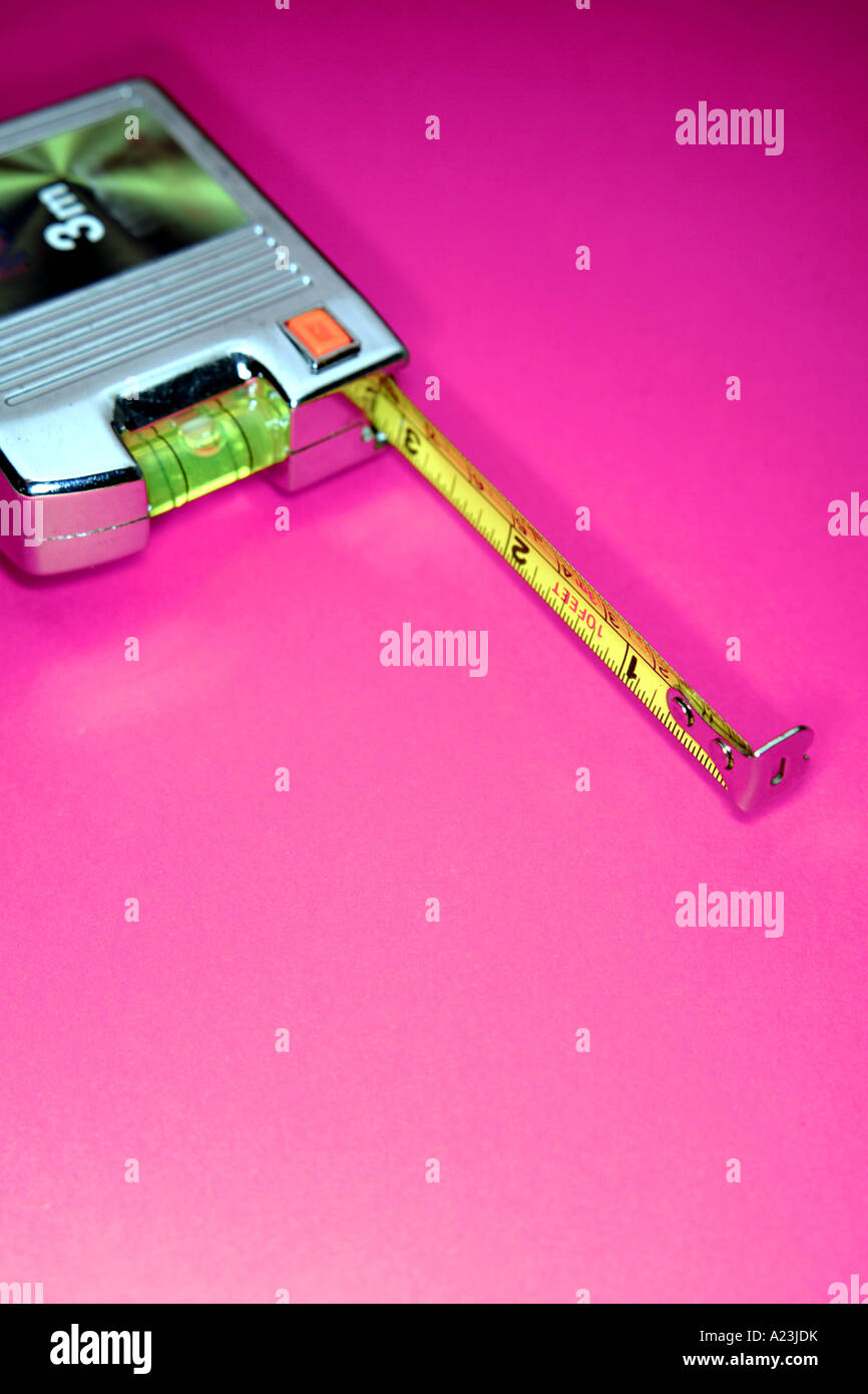 Tape measure with built-in spirit level on bright background Stock ...