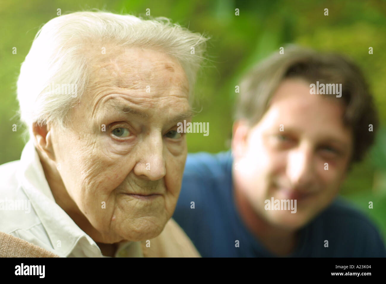 Portrait of an old lady with carer Stock Photo - Alamy