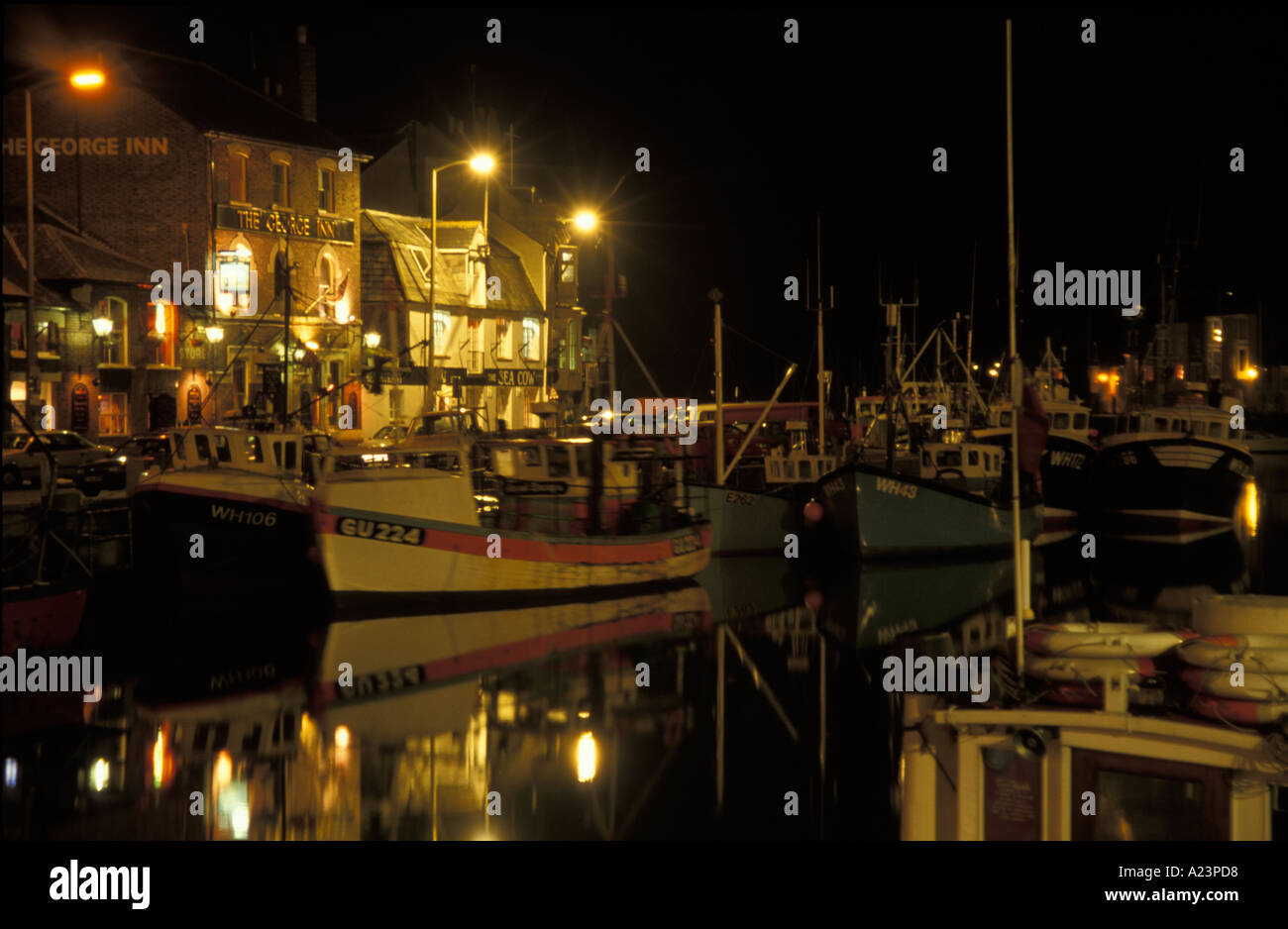 Ships in Weymouth harbour at night Dorset England Stock Photo - Alamy