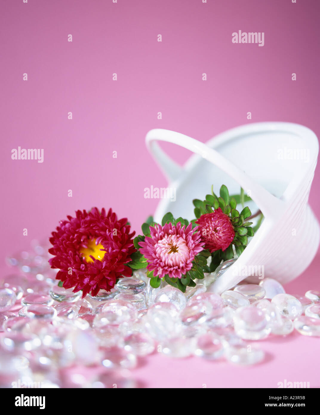 Flowers spilling from basket Stock Photo - Alamy