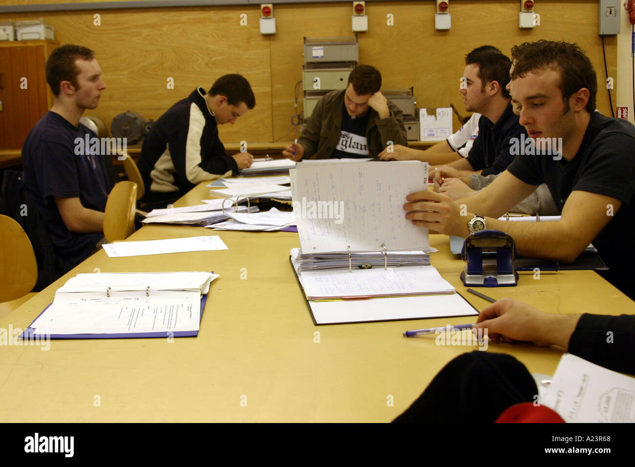 students sitting around table during study time at College Stock Photo ...