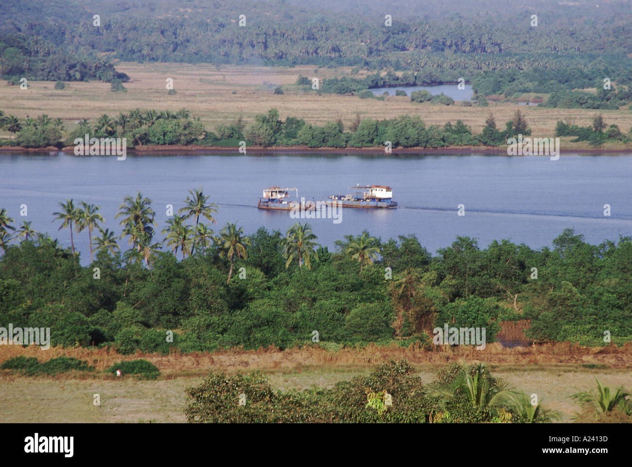 A ferry boat crosses a river. Goa, India Stock Photo - Alamy