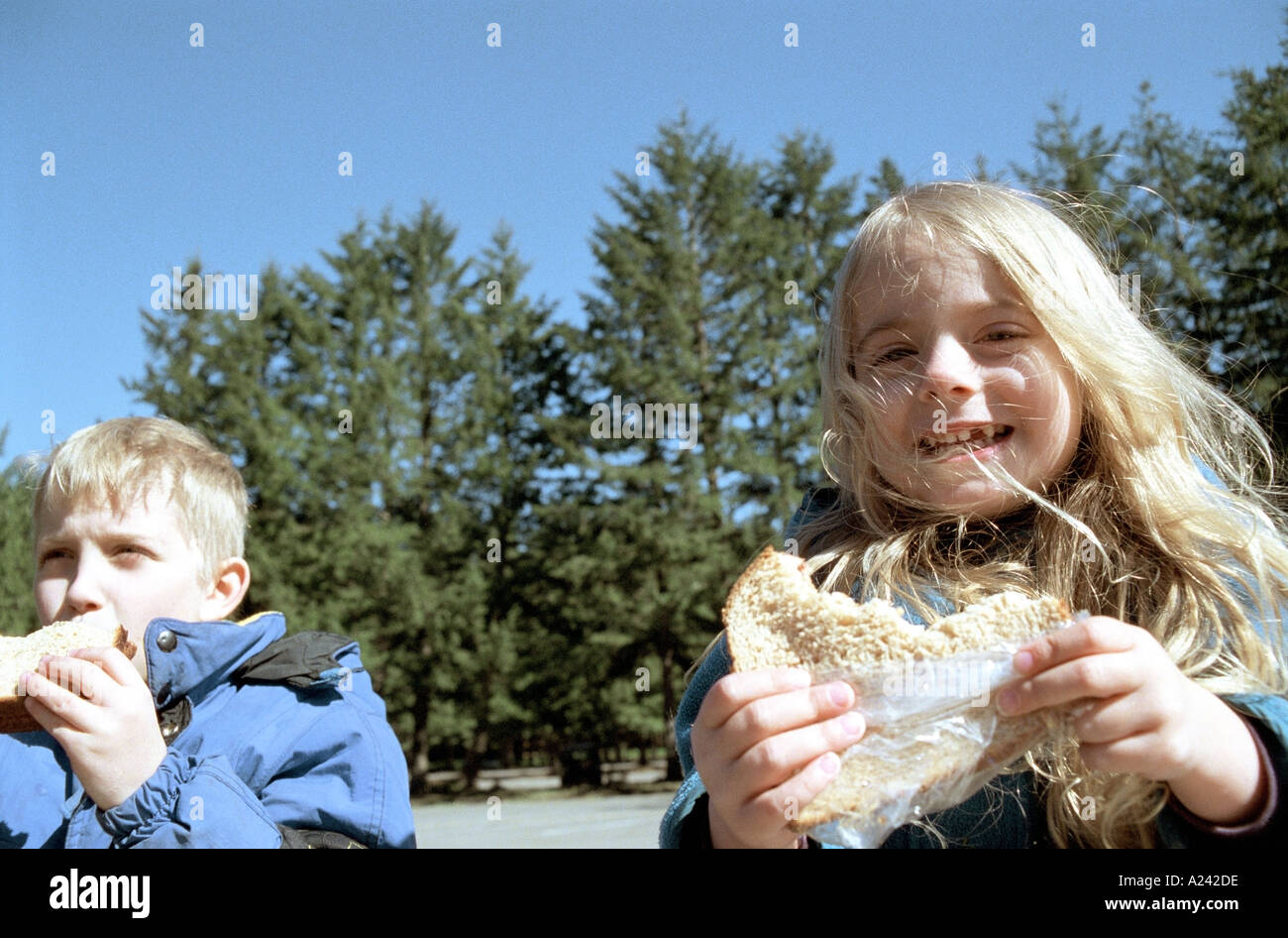 Child sharing sandwich hi-res stock photography and images - Alamy