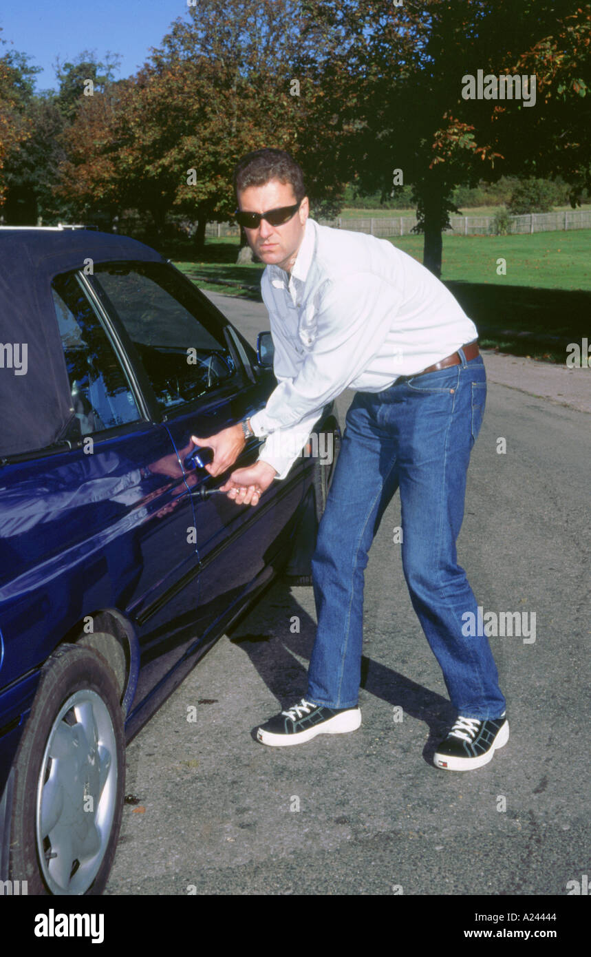 Man breaking in hi-res stock photography and images - Alamy