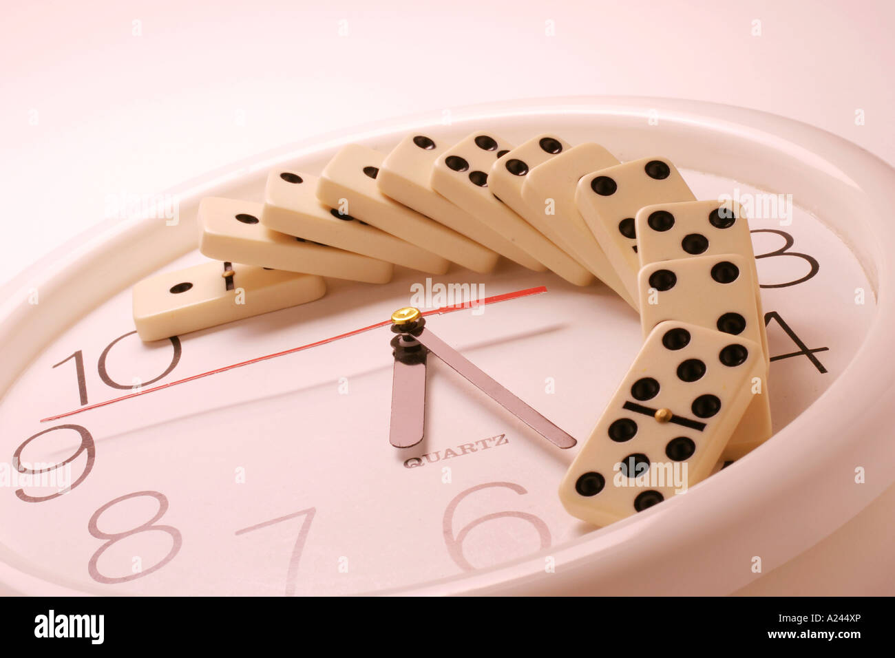 Dominoes on Clock Stock Photo - Alamy