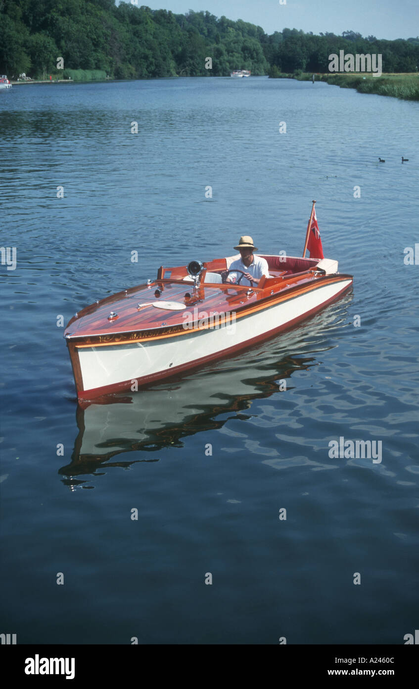 A young man in an electric powered slipper launch River Thames Henley ...