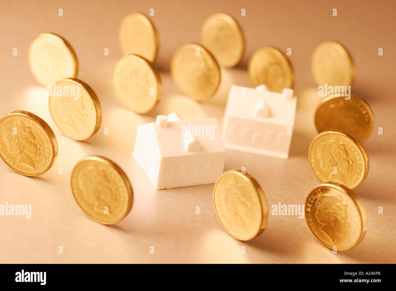 Coins and Miniature Buildings Stock Photo - Alamy