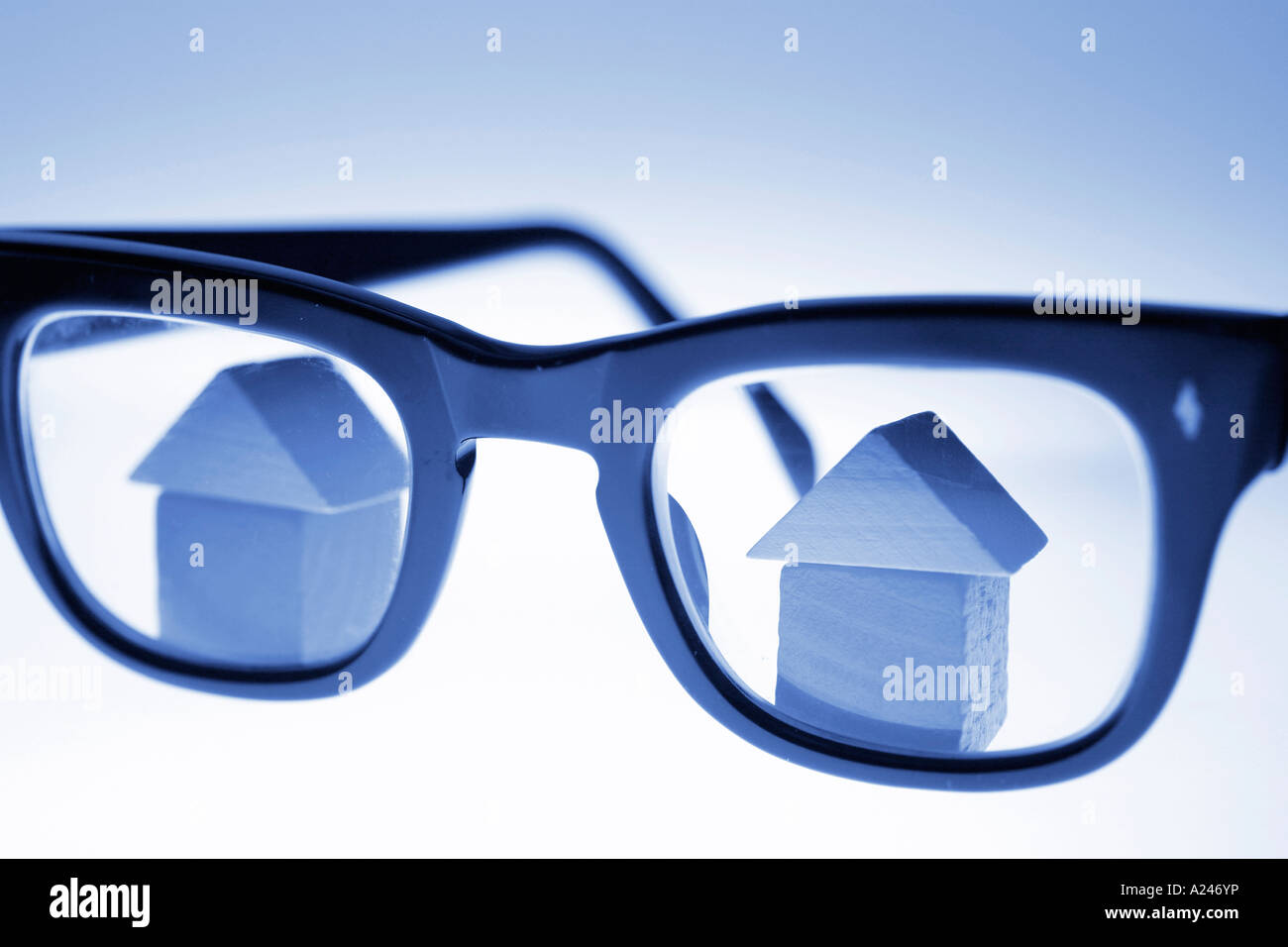 Eyeglasses and House Models Stock Photo - Alamy