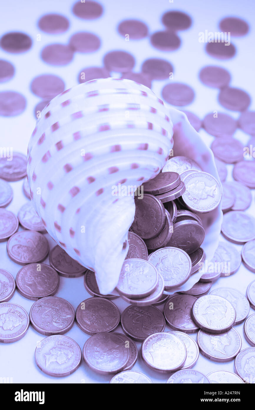 Conch with Coins Stock Photo - Alamy