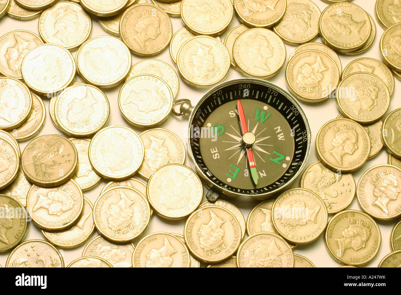 Compass and Coins Stock Photo - Alamy