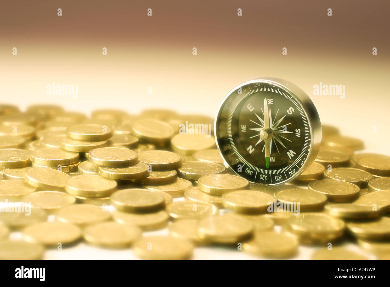 Compass and Coins Stock Photo - Alamy