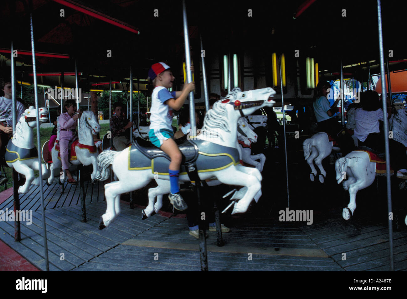 Child on merry go round many more country fair images available Stock ...