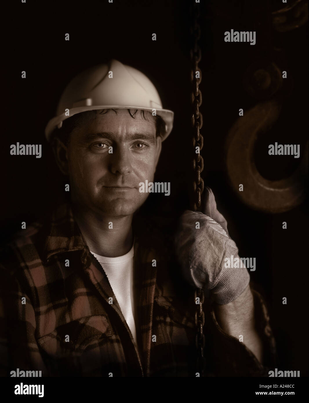 CONSTRUCTION WORKER WITH HARD HAT AND CHAIN Stock Photo - Alamy