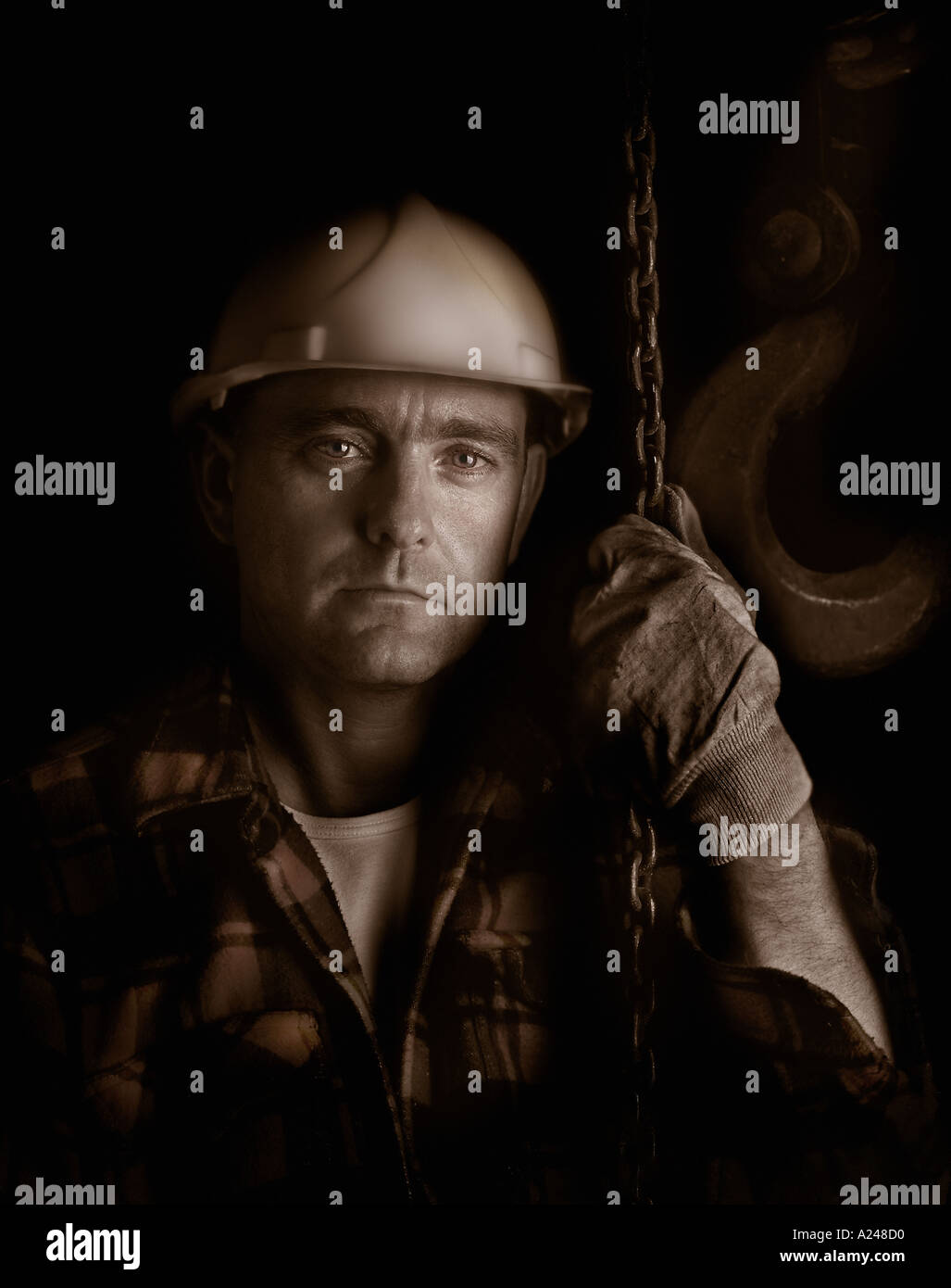 CONSTRUCTION WORKER WITH HARD HAT AND CHAIN Stock Photo - Alamy