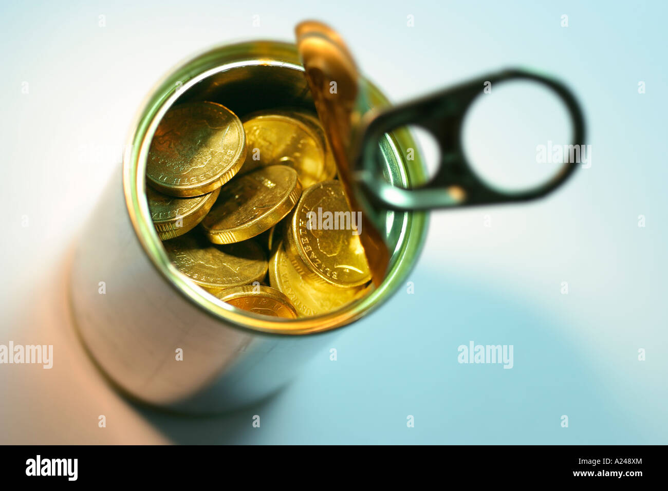 Coins in Tin Can Stock Photo - Alamy