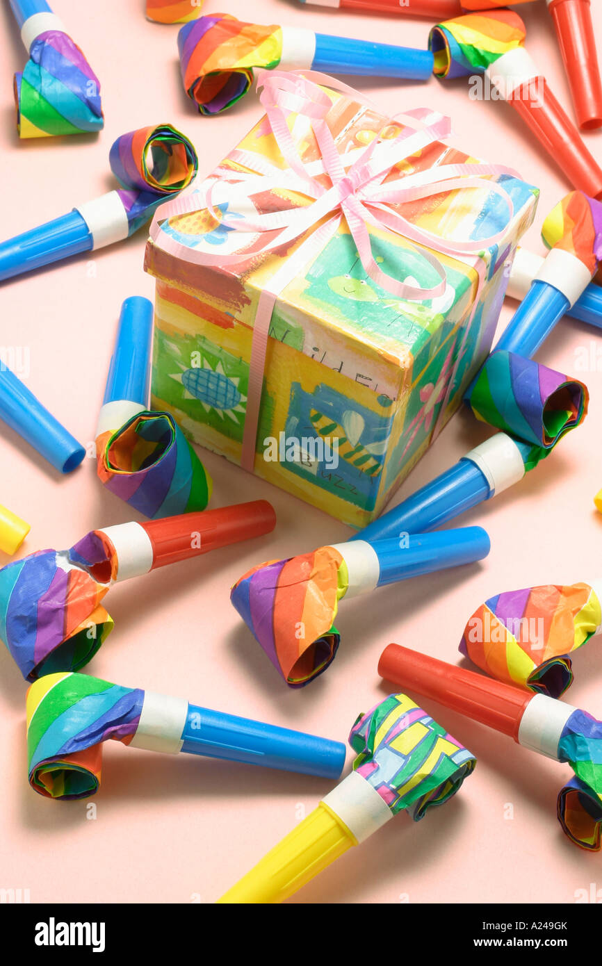 Gift Box and Party Blowers Stock Photo - Alamy