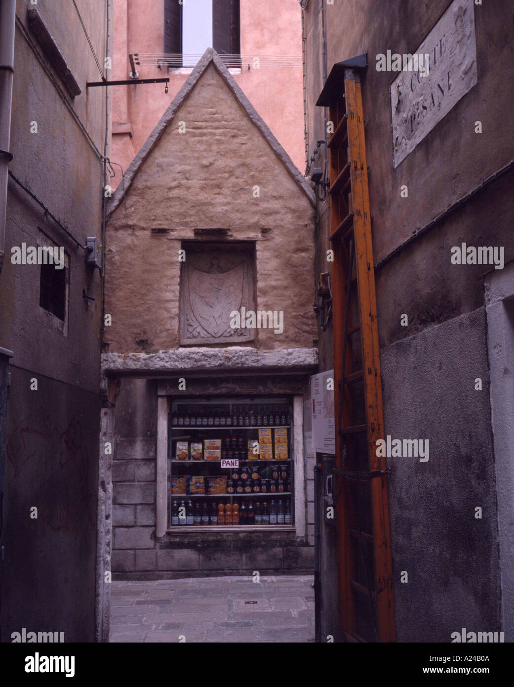 Backstreet narrow street paved street shop window display hi-res stock ...
