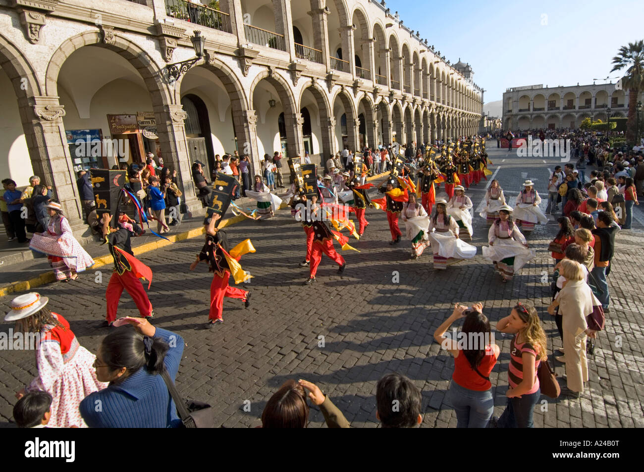Participents at one of the many street festivals held in Peruvian towns ...
