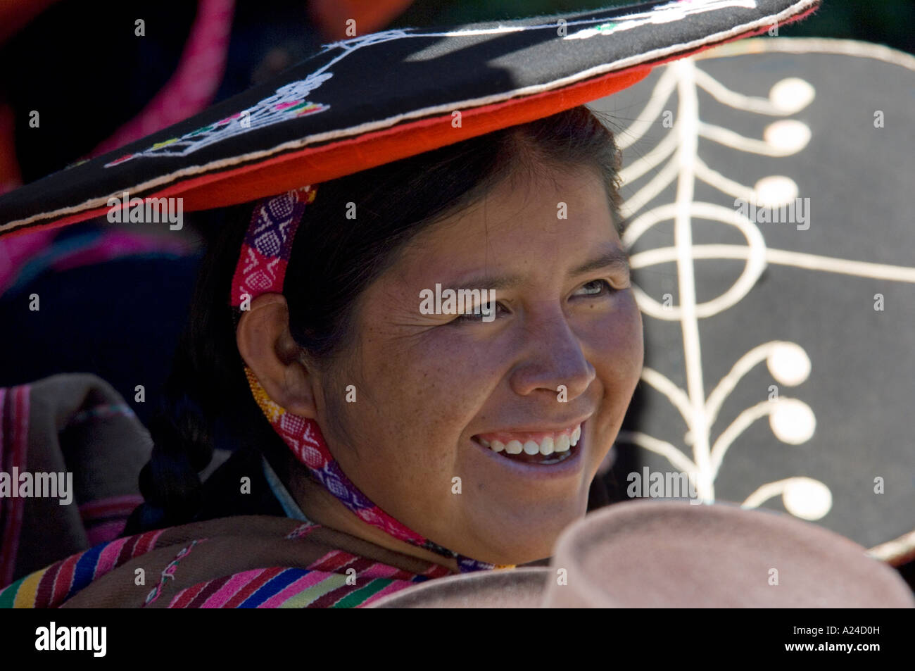 A head and shoulder portrait of a smiling local Hispanic Peruvian woman ...