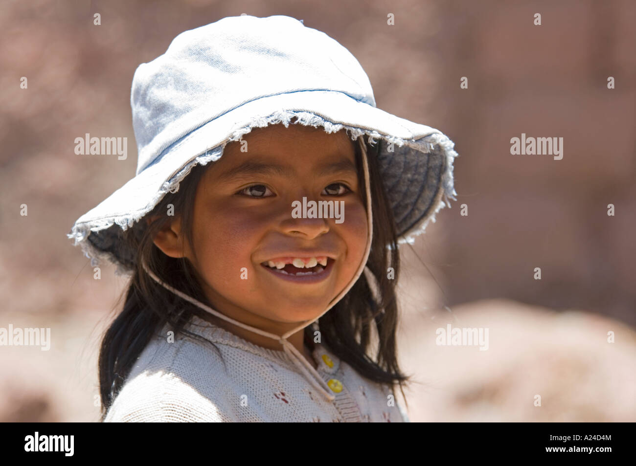 A head and shoulder portrait of a smiling local Hispanic young Peruvian ...