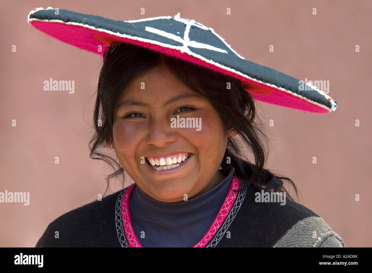 A head and shoulder portrait of a smiling local Hispanic Peruvian woman ...