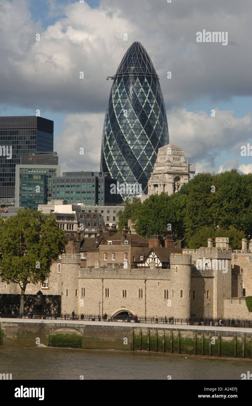 Swiss Re building 30 St Mary Axe or The Gherkin and Tower of London ...