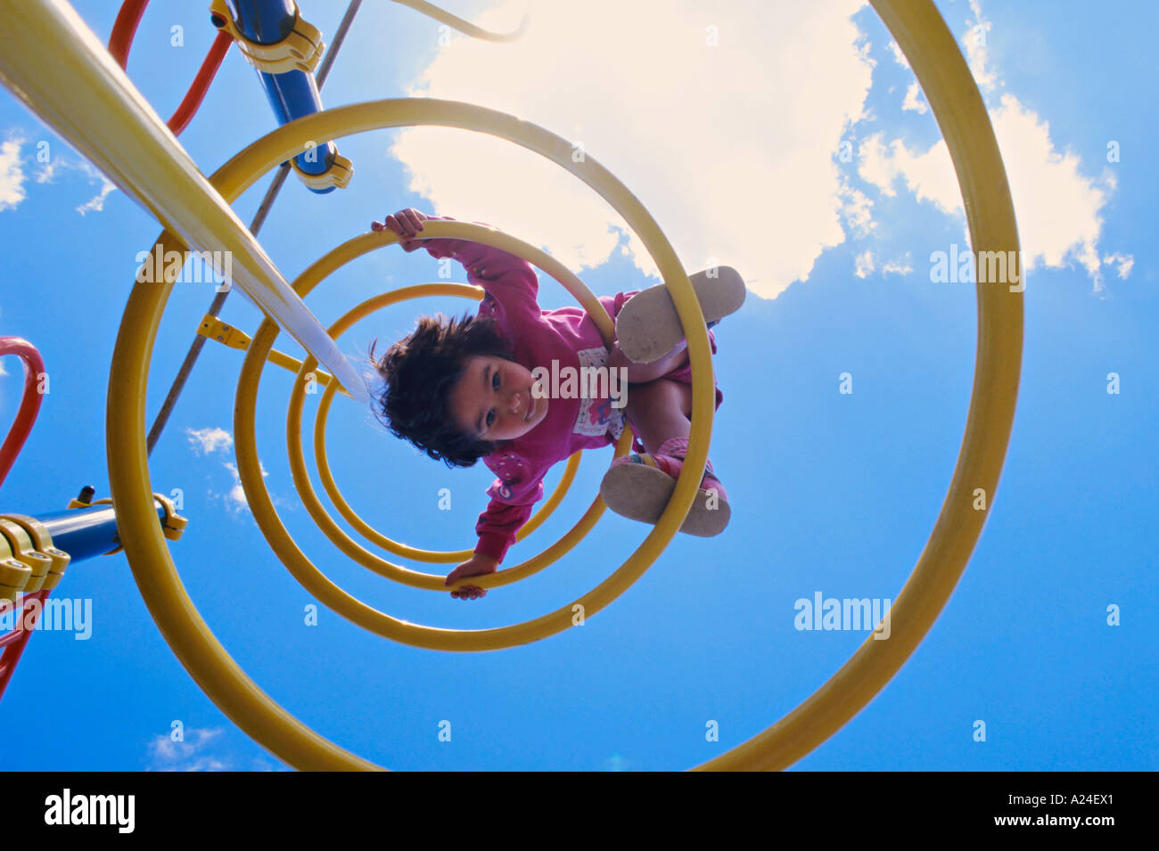 child on playground equipment Stock Photo - Alamy