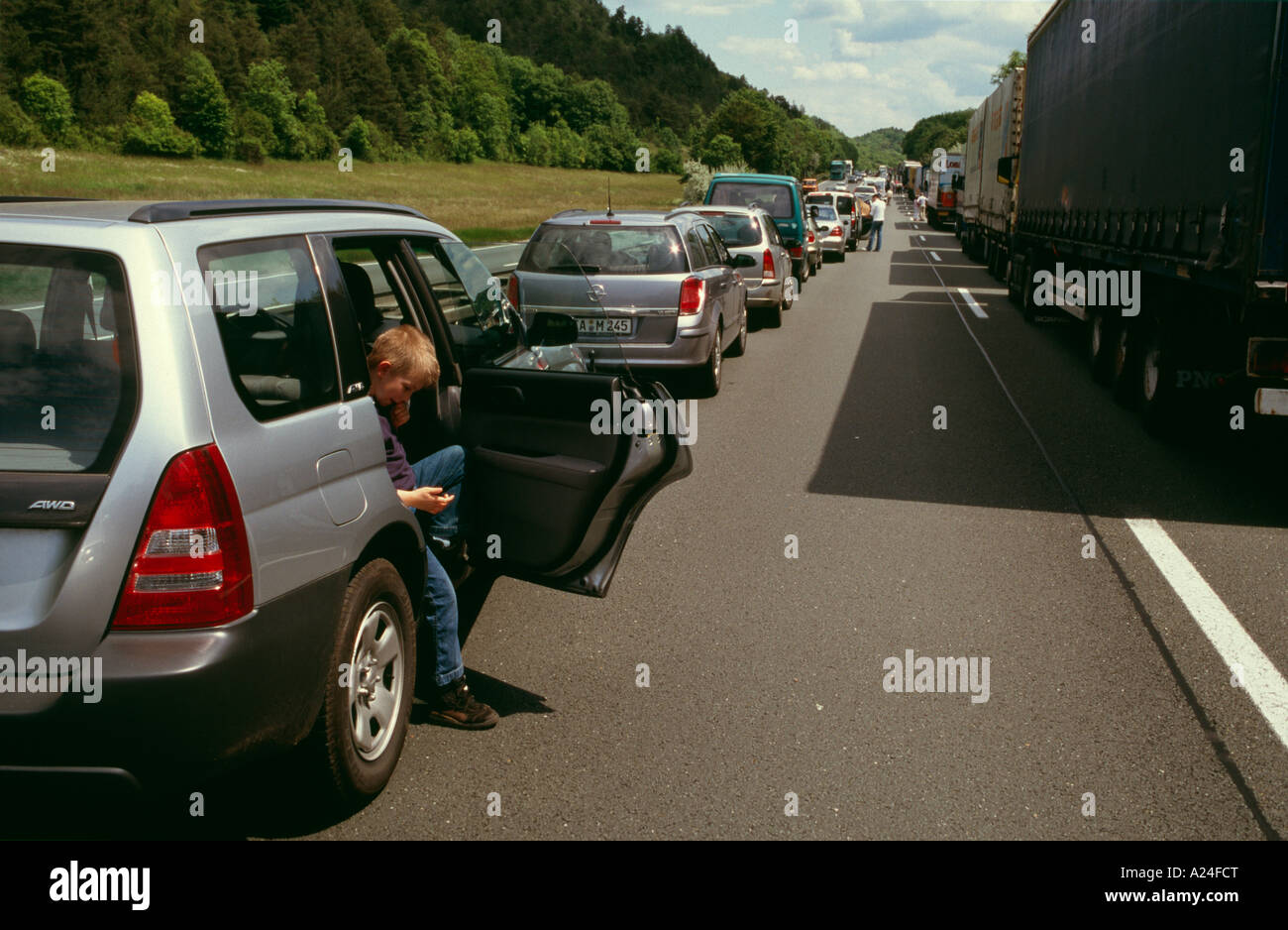 Child in traffic jam Stock Photo - Alamy