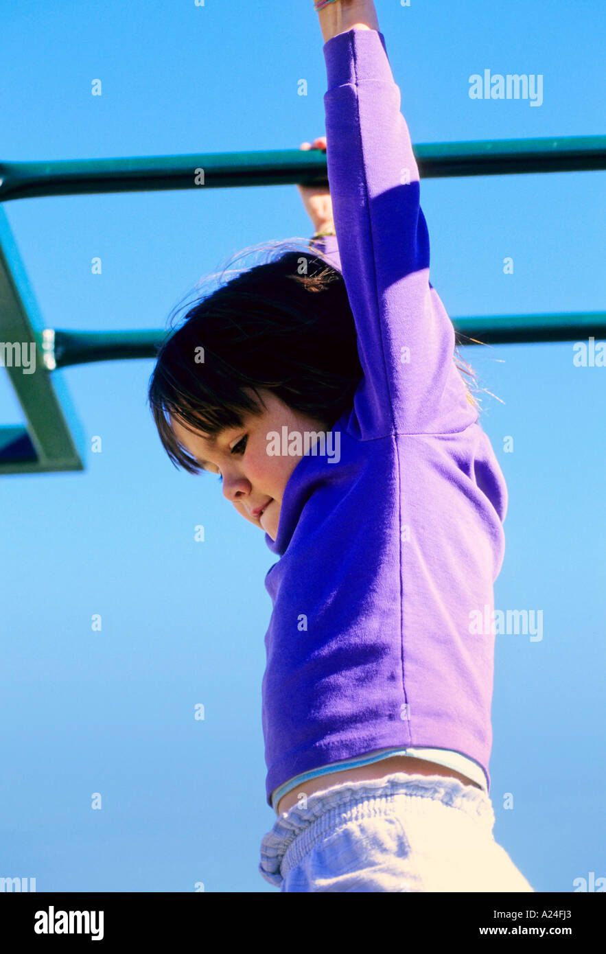 child on playground equipment Stock Photo - Alamy