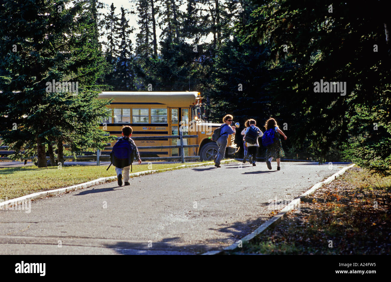 Children running school bus hi-res stock photography and images - Alamy