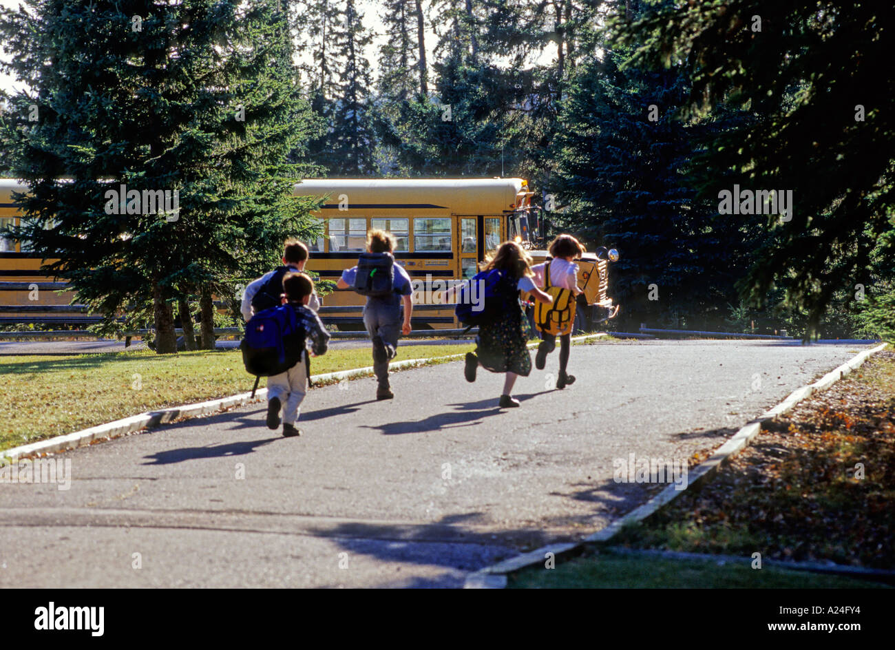 Children running school bus hi-res stock photography and images - Alamy