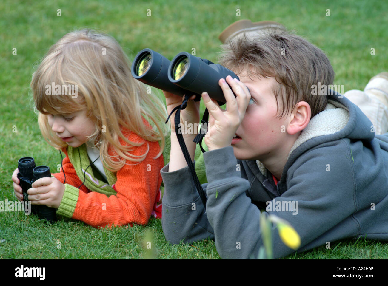 children having fun using binoculars Stock Photo - Alamy
