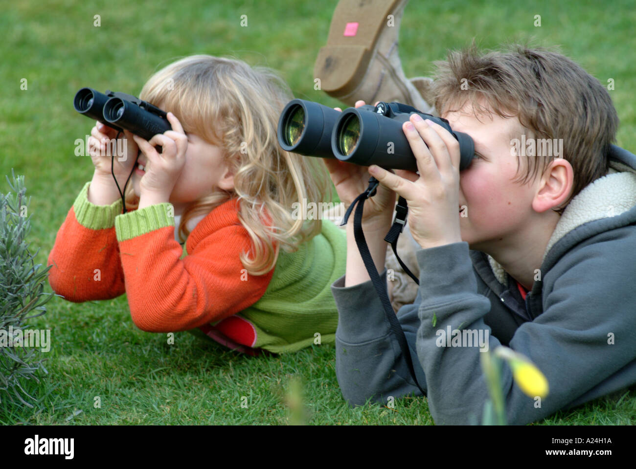 children having fun using binoculars Stock Photo - Alamy