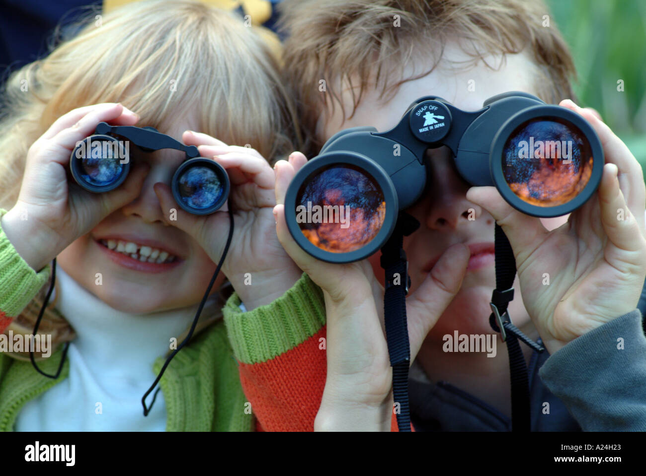 children having fun using binoculars Stock Photo - Alamy