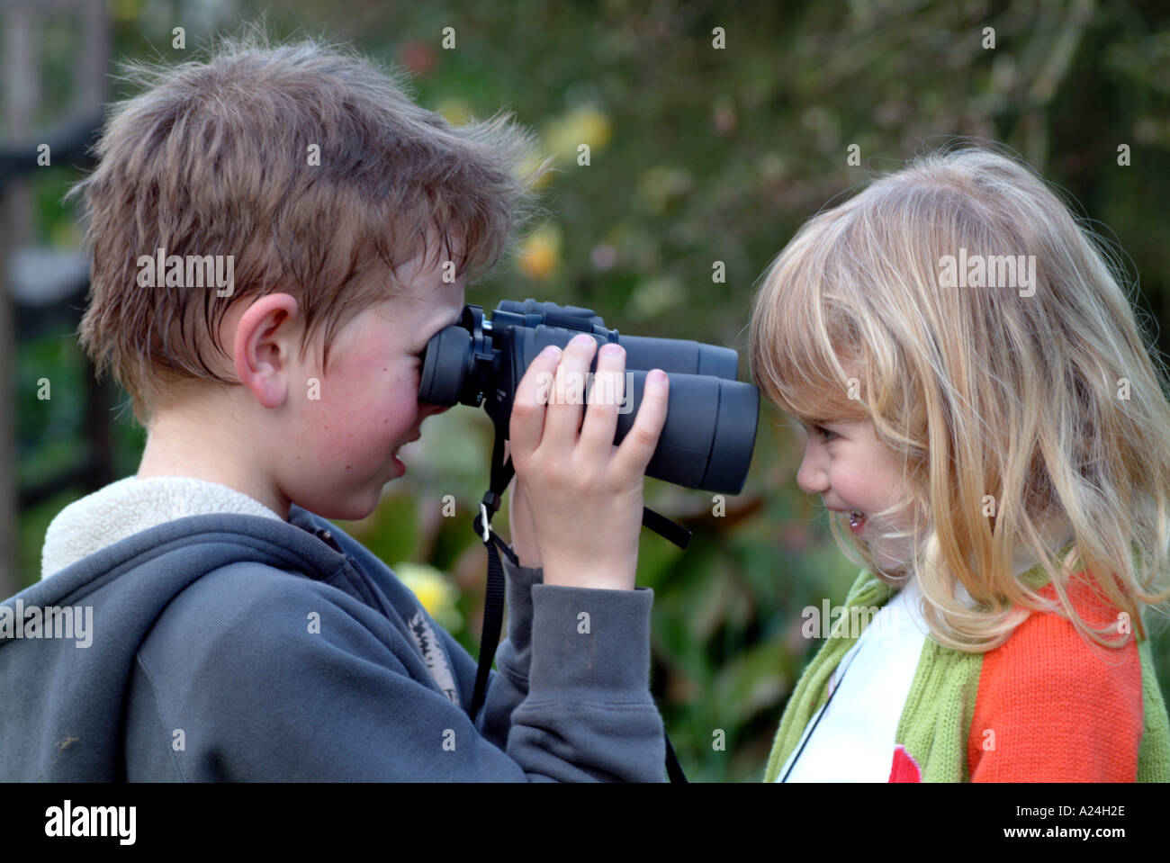 children having fun using binoculars Stock Photo - Alamy