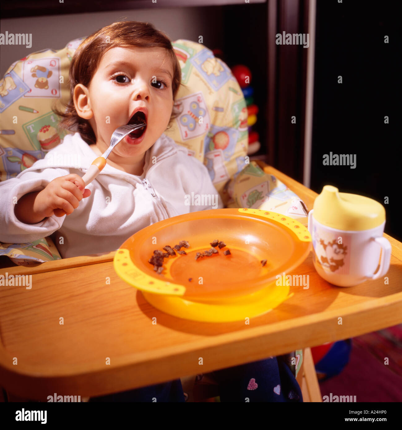 little baby girl eating Stock Photo - Alamy