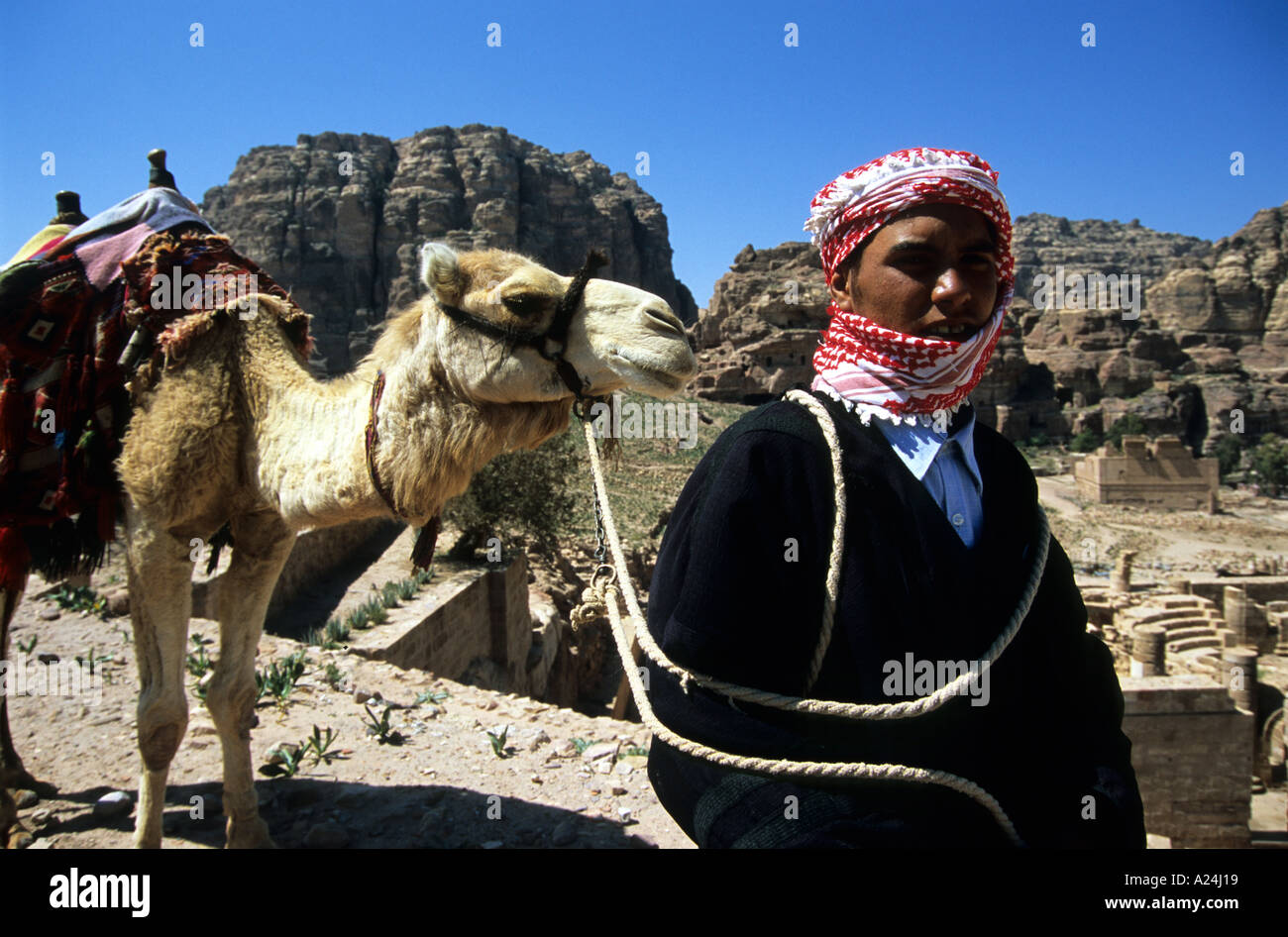Camel driver and camel Petra Jordan Stock Photo - Alamy