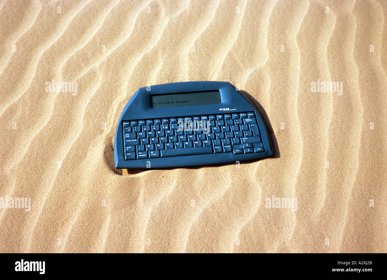 Alphasmart Neo in sand Stock Photo - Alamy