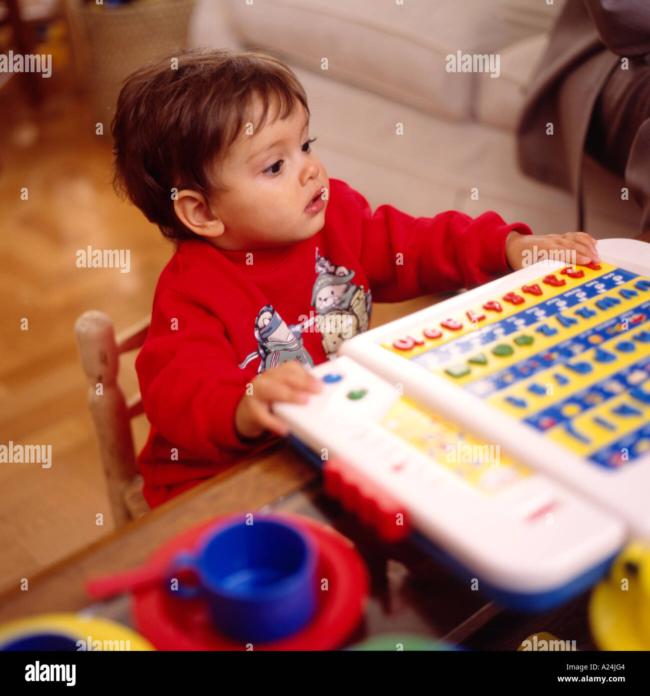 little baby girl learning letters Stock Photo - Alamy